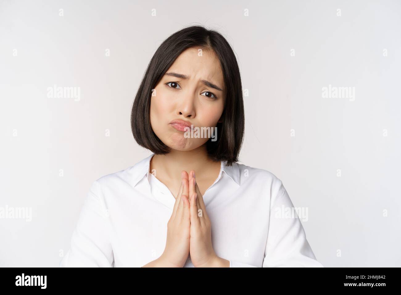Close Up Portrait Of Asian Woman Begging Asking For Smth Say Please