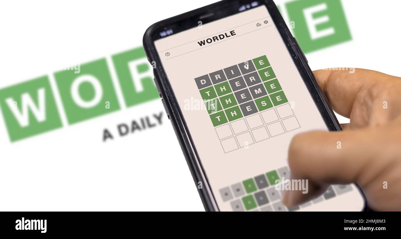 Rome, Italy, January 2022: hand holding a phone with Wordle game ...