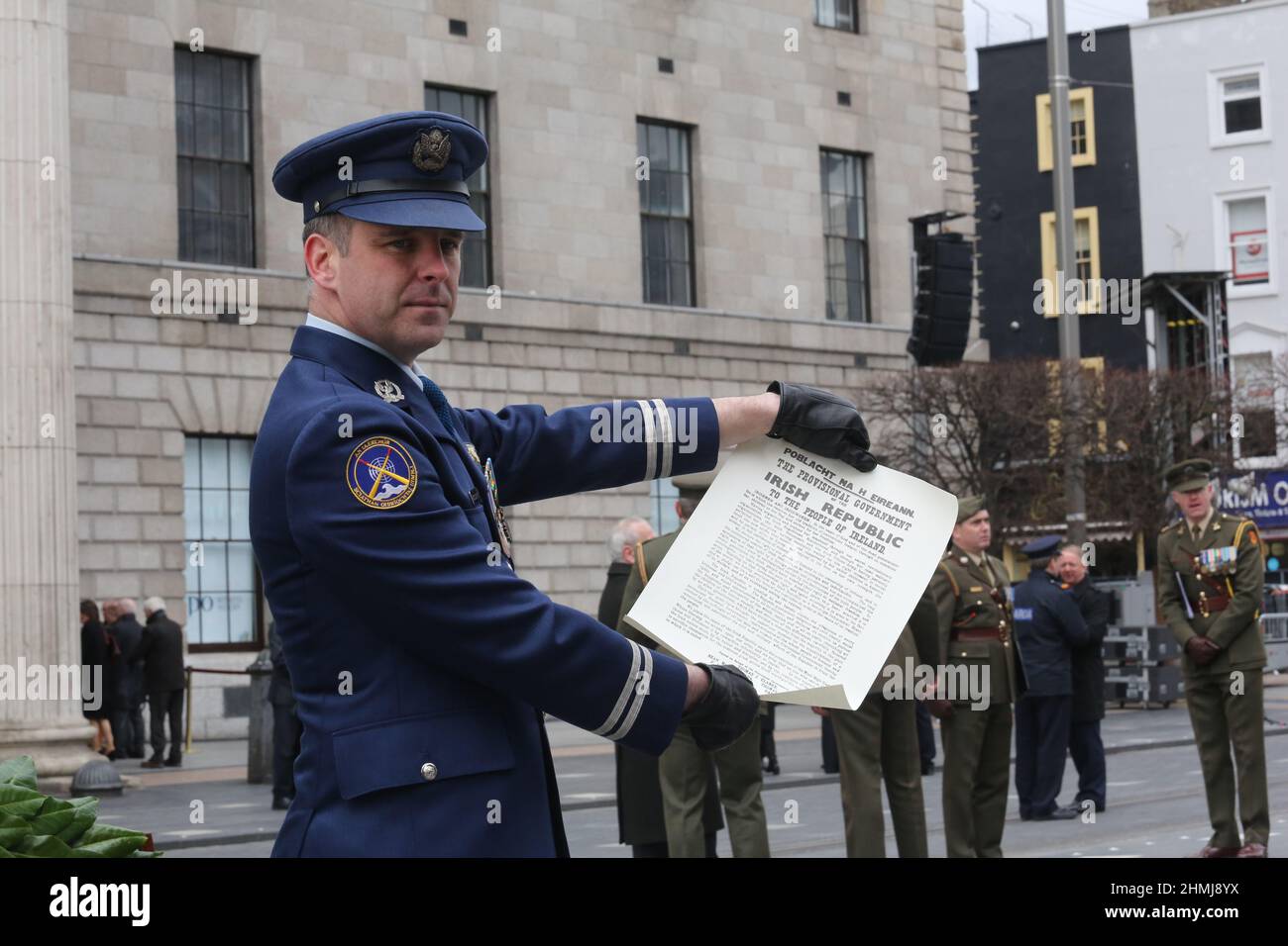 A copy of the 1916 proclamation is held up for photographers after a ...