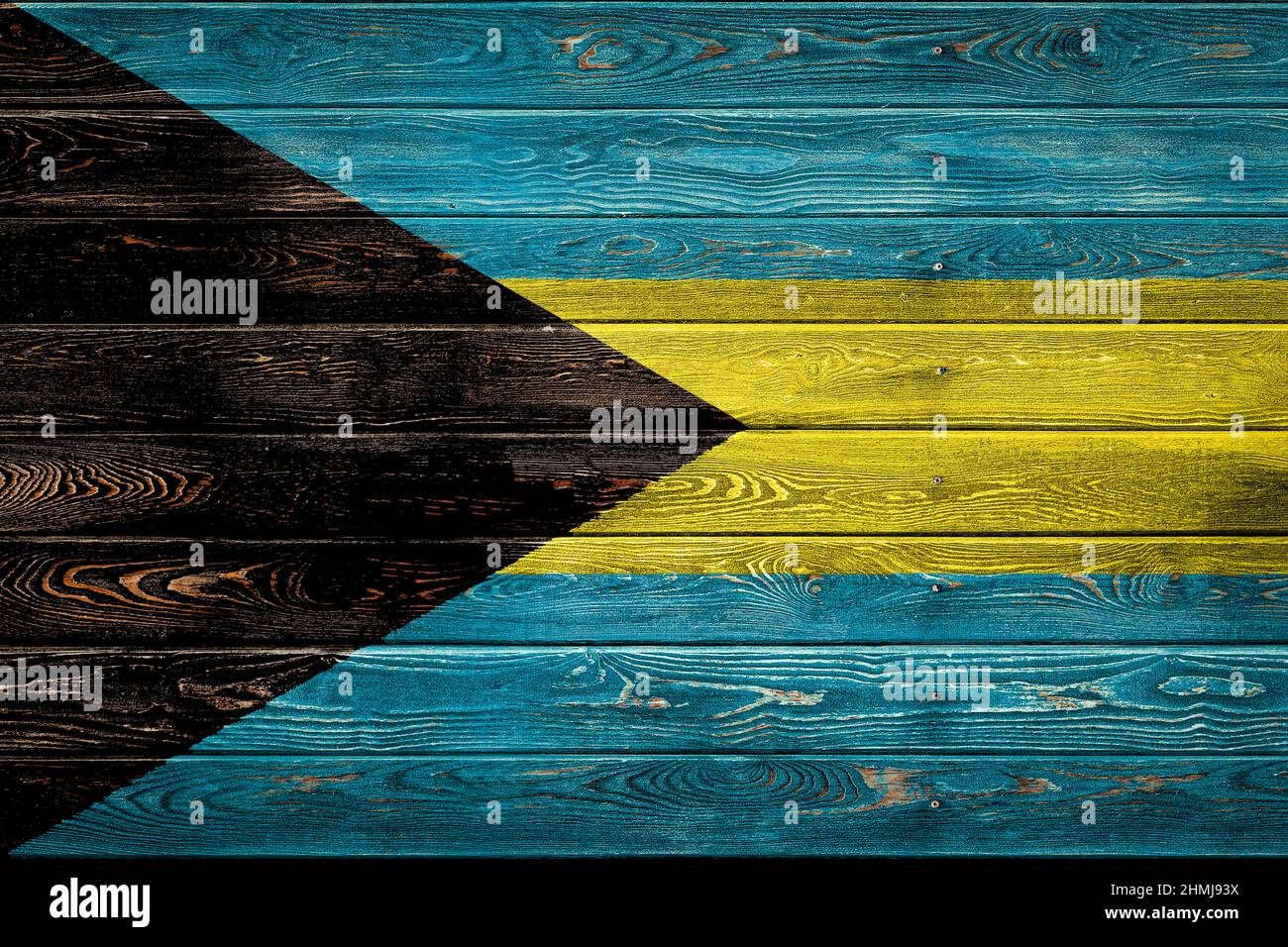 The national flag of Bahamas is painted on a camp of even boards nailed ...