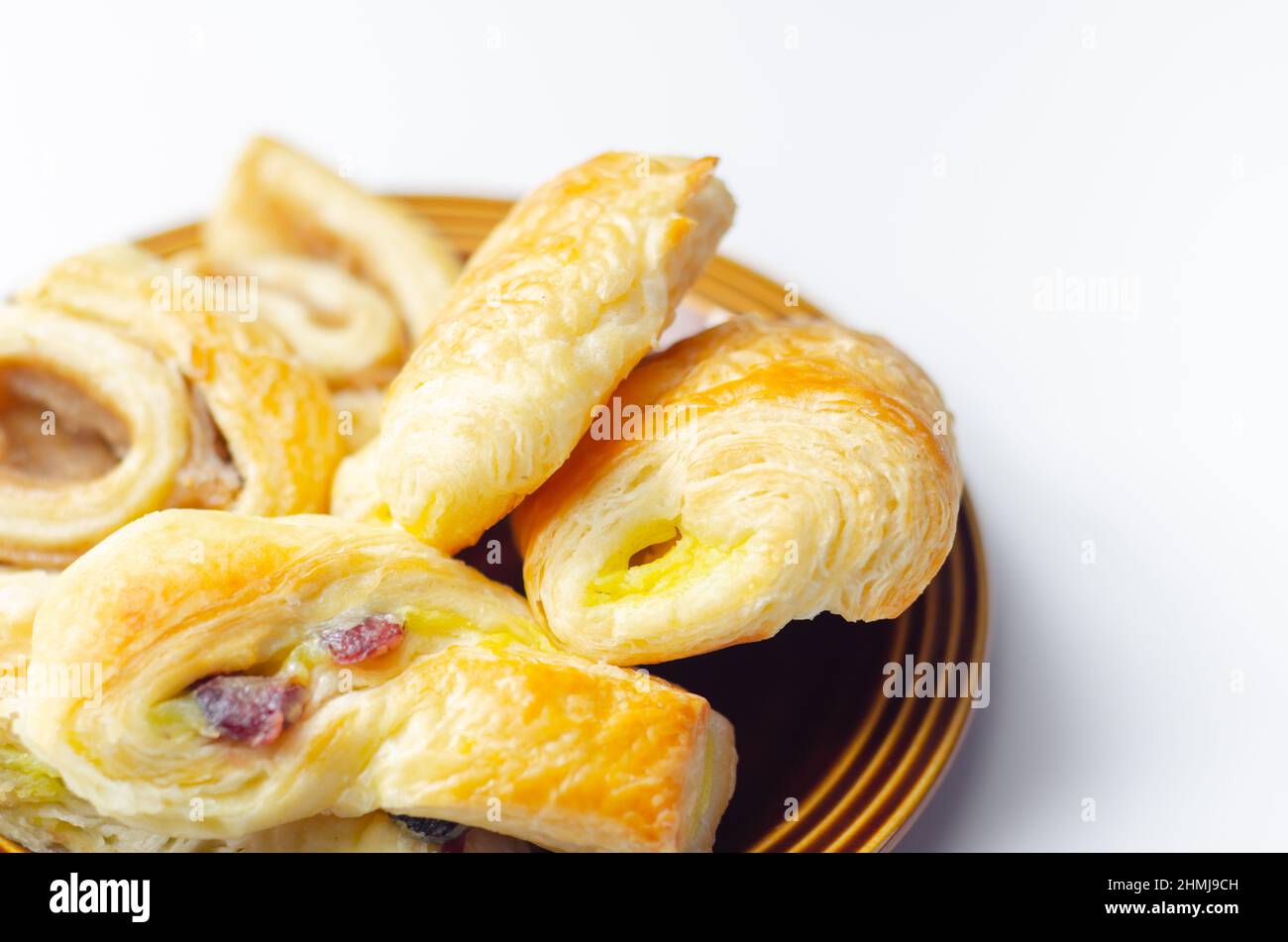 Set of various traditional pastry sweet mini Danish on the brown plate ...