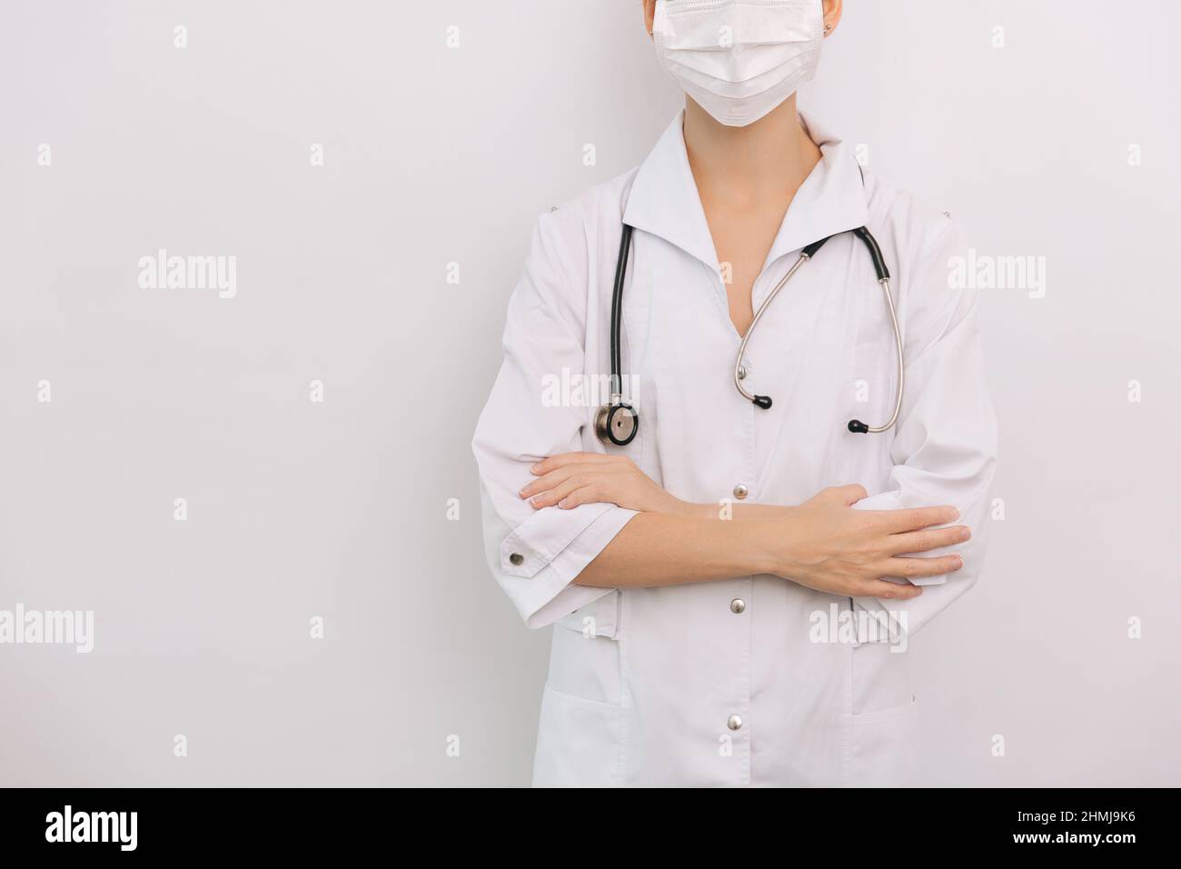 Doctor with stethoscope in medical coat on white background. Front ...