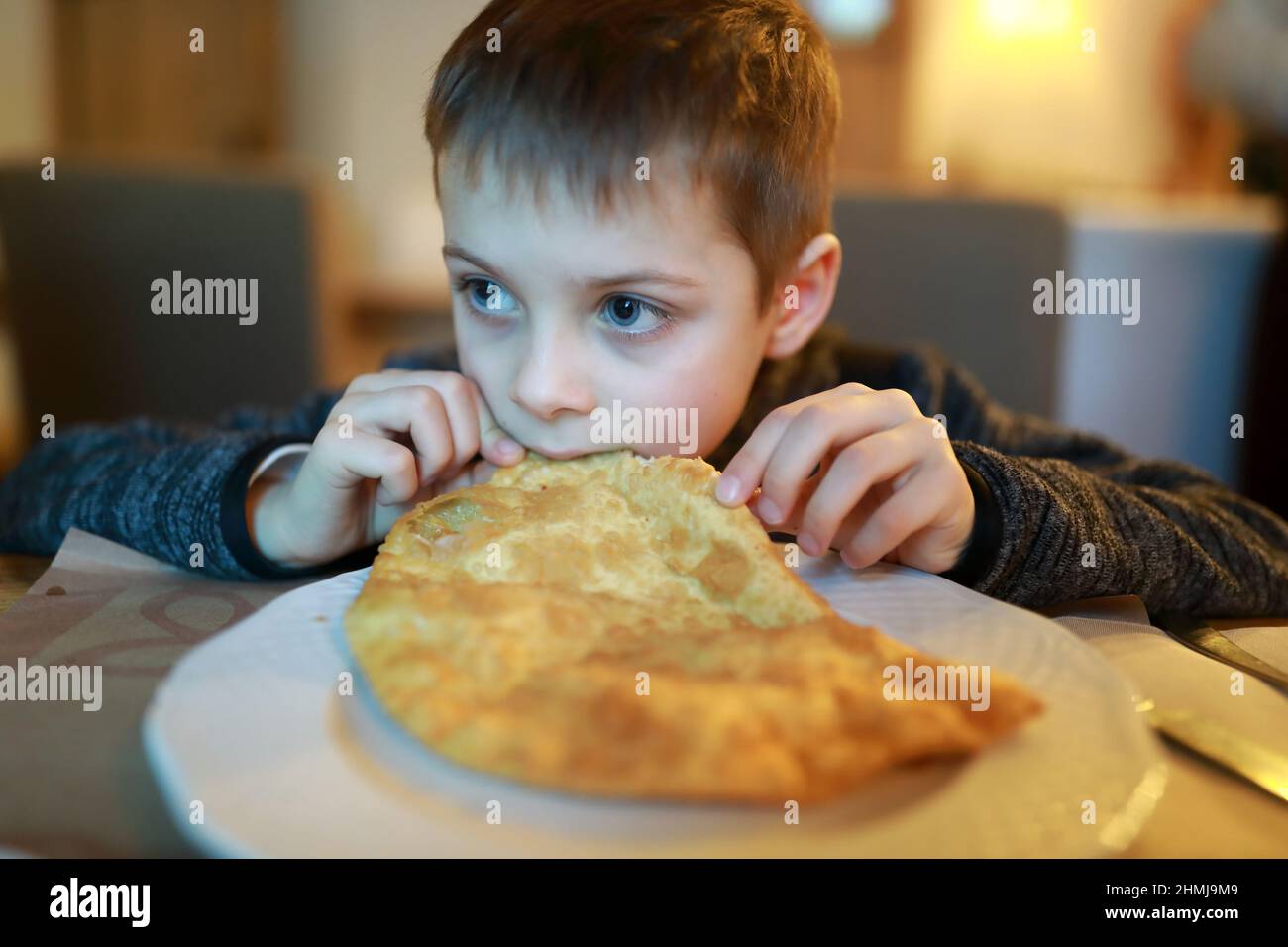 Child eating lunch in cafeteria hi-res stock photography and images - Alamy