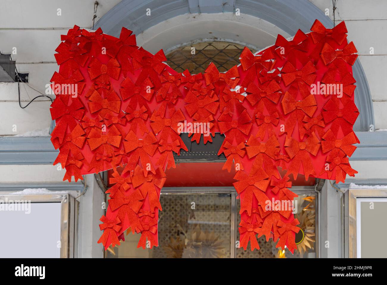 Big Red Bow Festive Decor at Building Stock Photo - Alamy