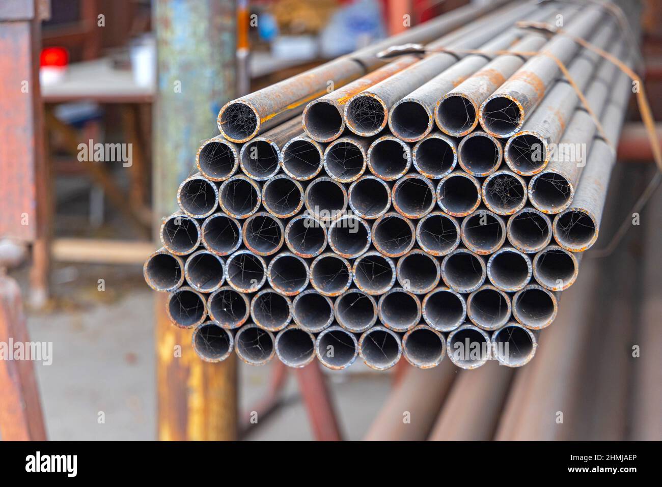 Steel Pipes at Shelf in Construction Material Warehouse Stock Photo - Alamy