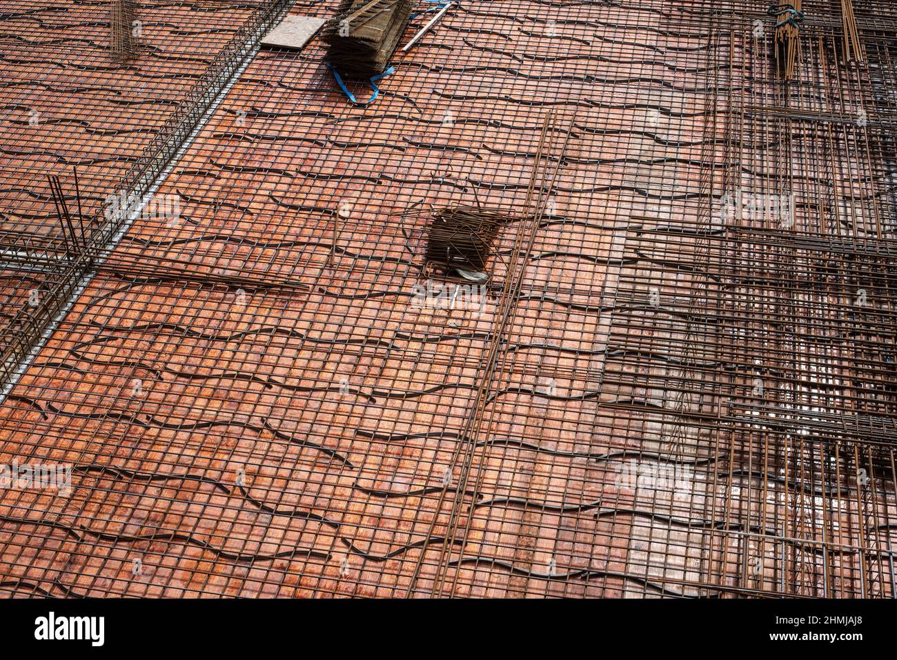 covering of wooden planks with a mesh of reinforcement steel at a ...