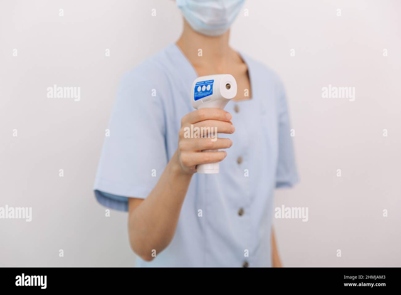 Temperature measurement gun in doctor hands. Close-up shot of doctor ...