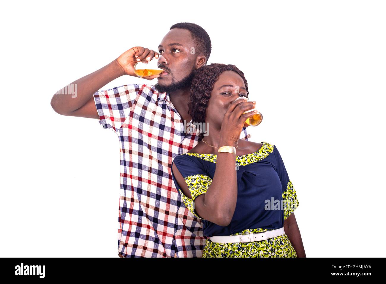 young people standing entwined on white background drinking beer Stock ...