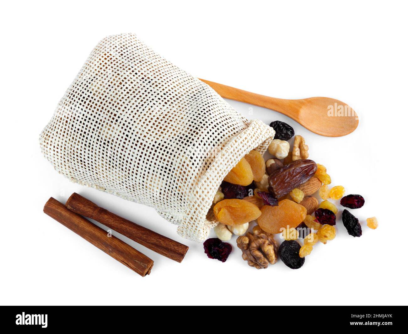Dried fruits and nuts in a sack on white background Stock Photo - Alamy