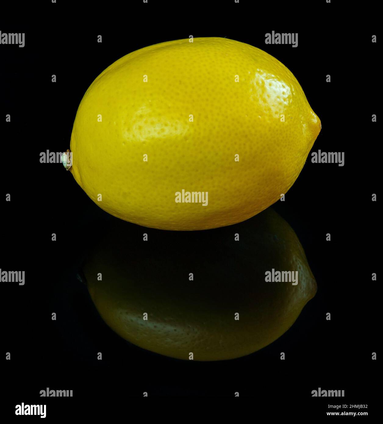 Lemons on reflective black studio background Stock Photo - Alamy