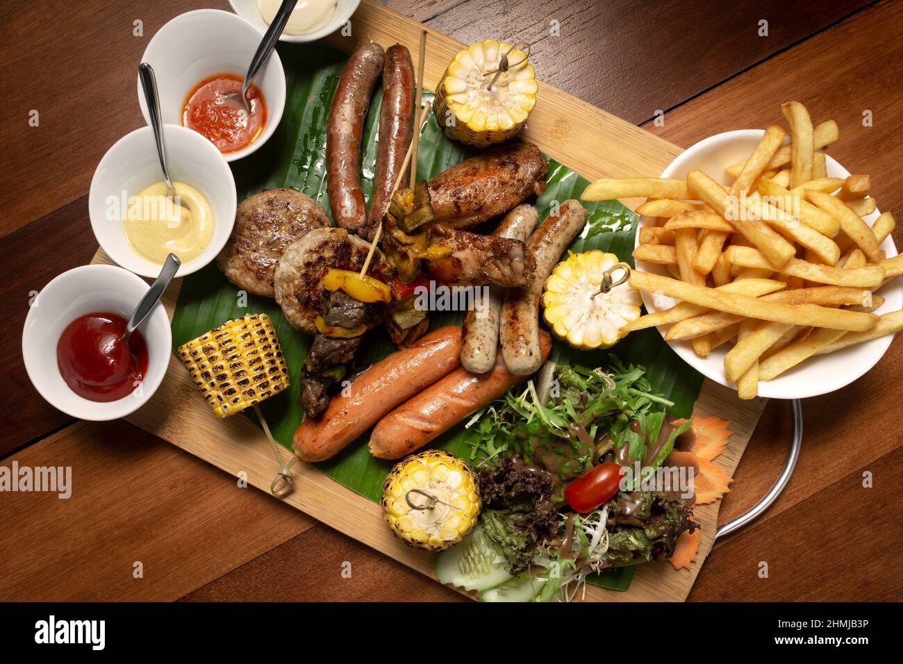 BBQ mixed meat platter with meatballs, sausages, skewers and chicken ...