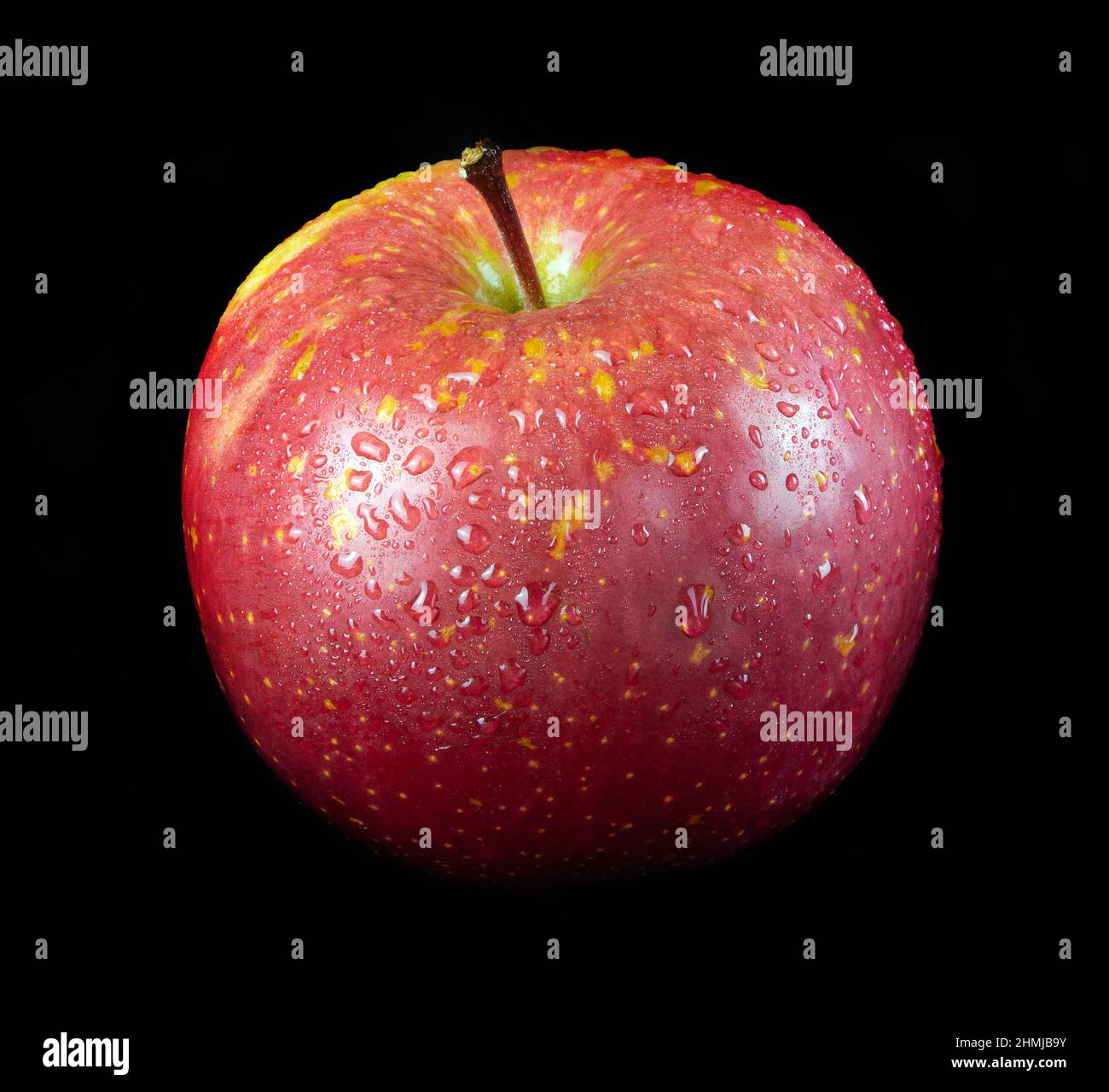Red apple on black background Stock Photo - Alamy