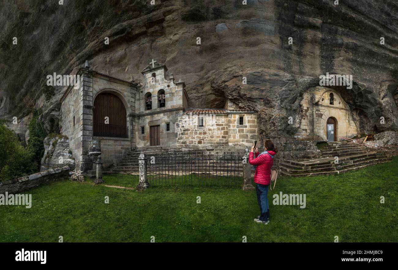 National Monument Ojo Guarena. Caves and church in the rocks. Merindades, Burgos, Spain Stock ...