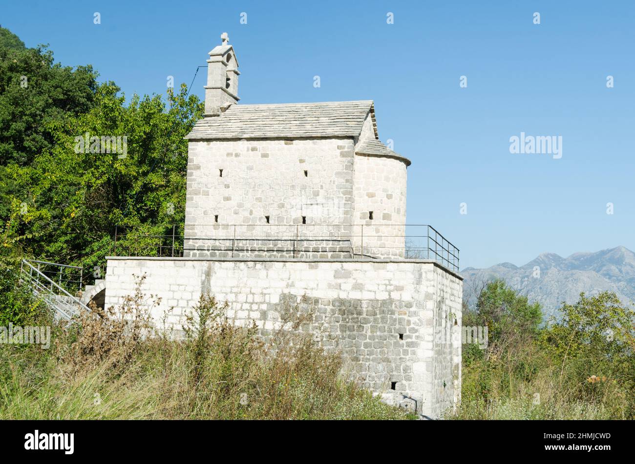 Old Church with a bell tower among green trees.Architecture and ...