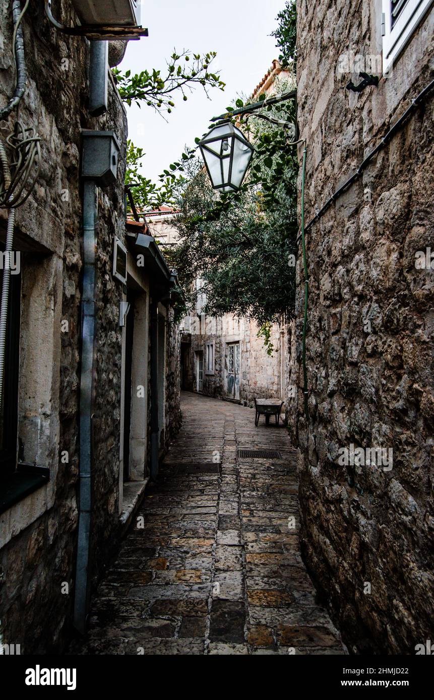 Narrow streets of the old stone town with stone blocks.On cloudy days Stock Photo - Alamy