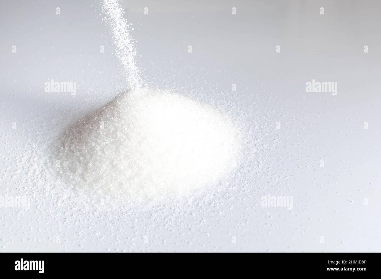 Pile of sugar sand on a light background, scatter, pour sugar. Food ...
