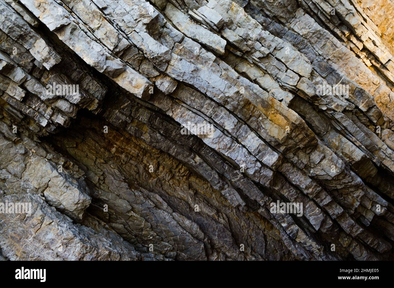 Rock, the background of the layers of ancient sediments.Layered stone ...
