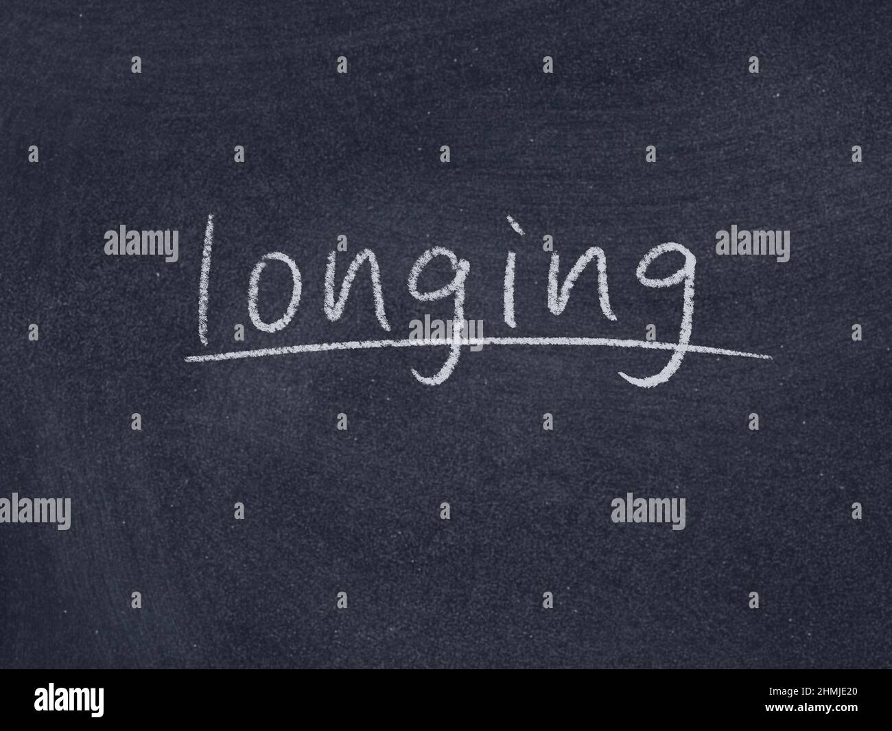longing concept word on blackboard background Stock Photo - Alamy