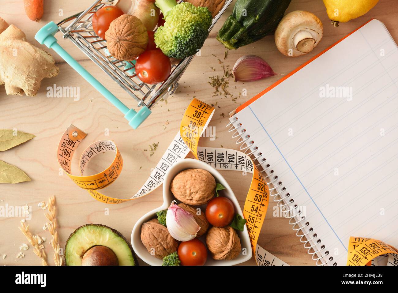 Notepad to score shopping list to prepare balanced food menus, with ...