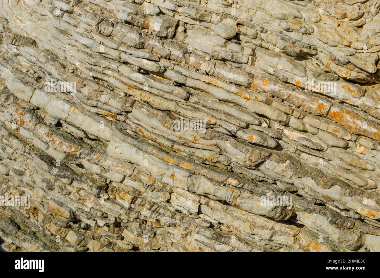 Rock, the background of the layers of ancient sediments.Layered stone ...