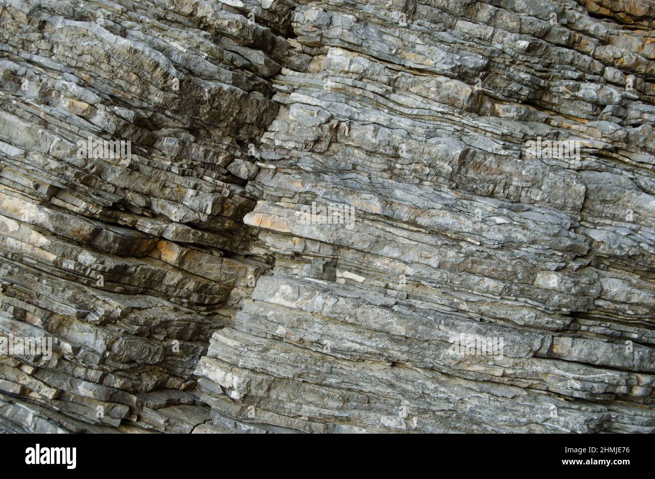 Rock, the background of the layers of ancient sediments.Layered stone ...