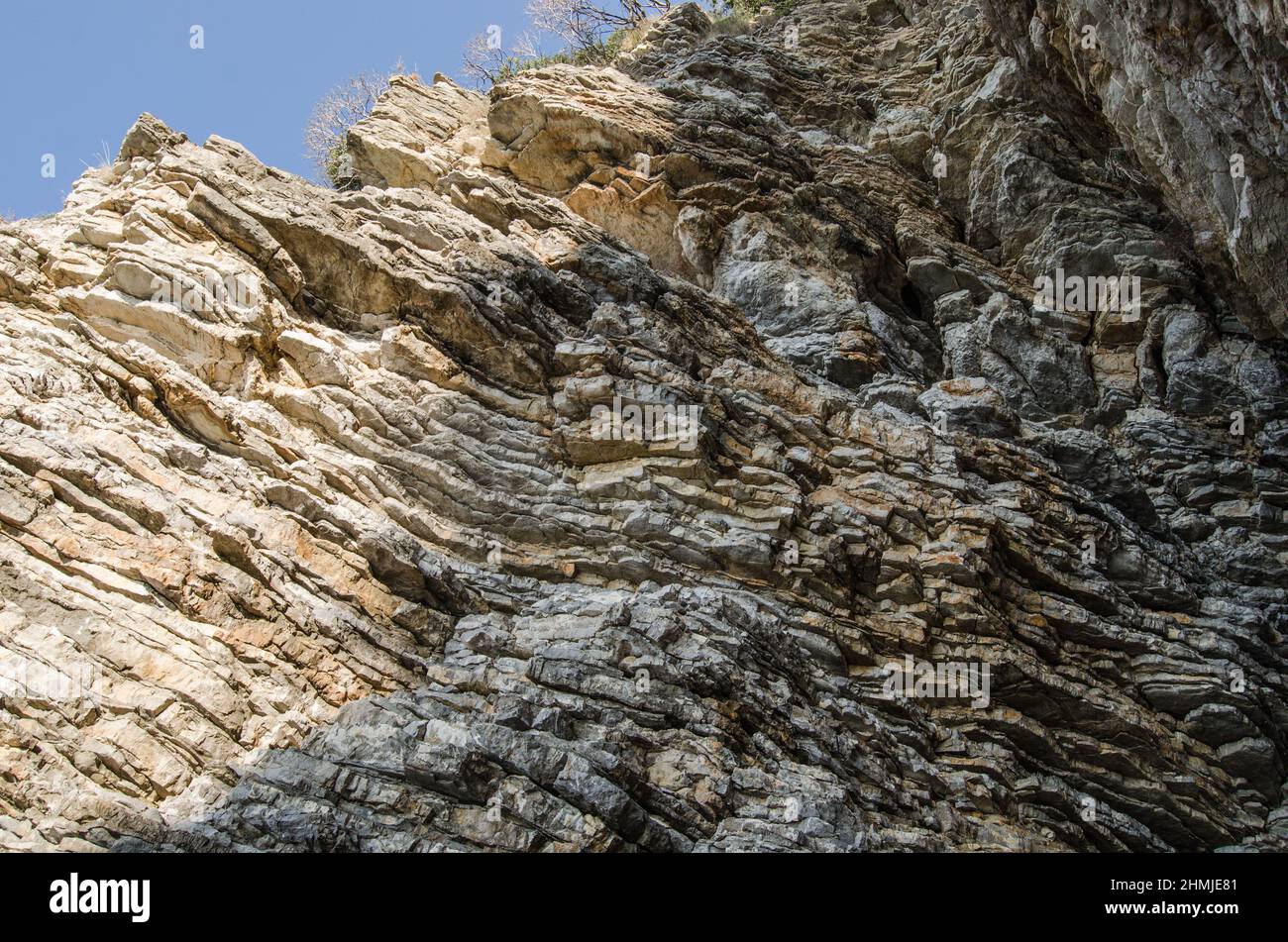Rock, the background of the layers of ancient sediments.Layered stone ...