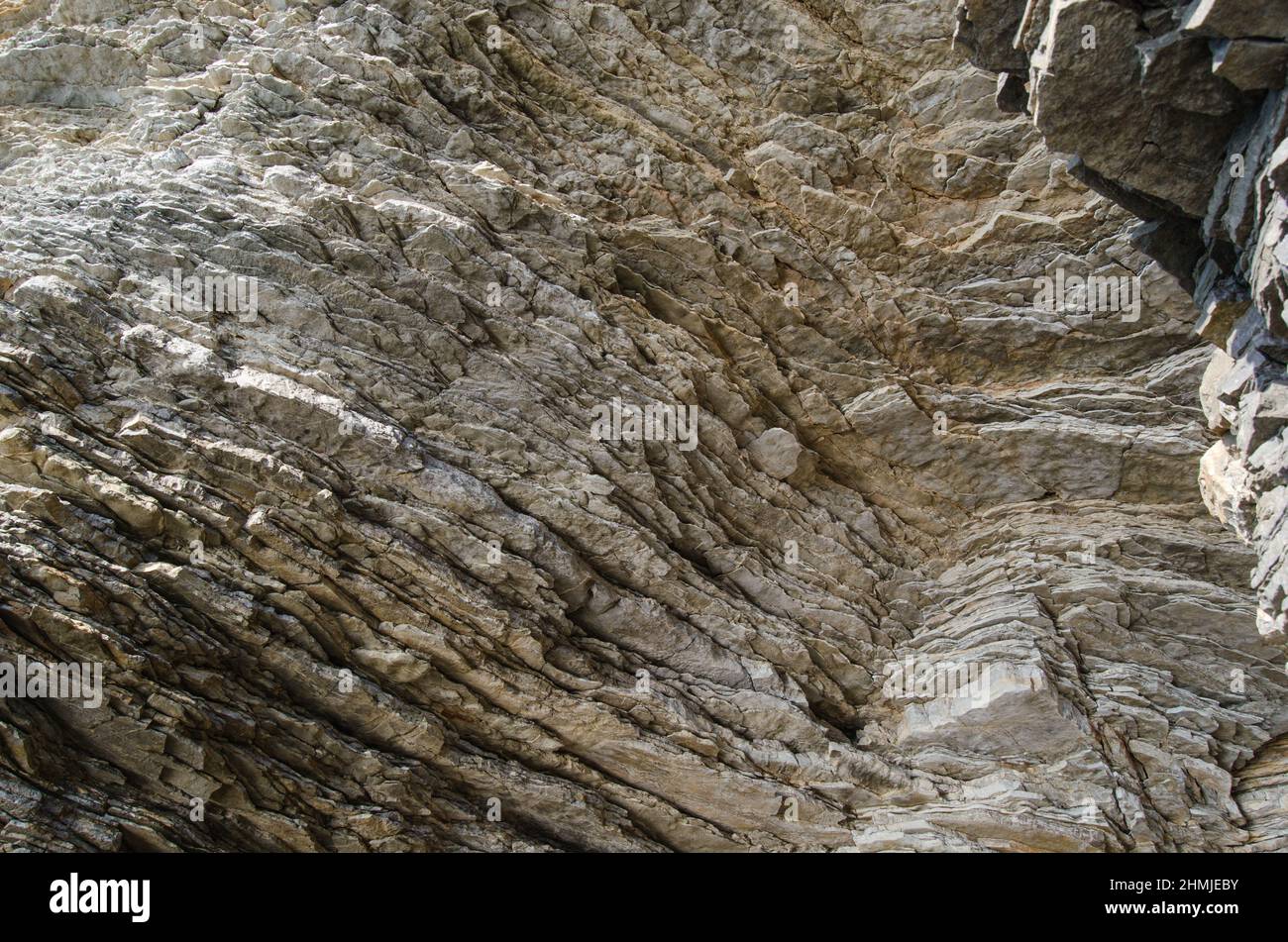 Rock, the background of the layers of ancient sediments.Layered stone ...