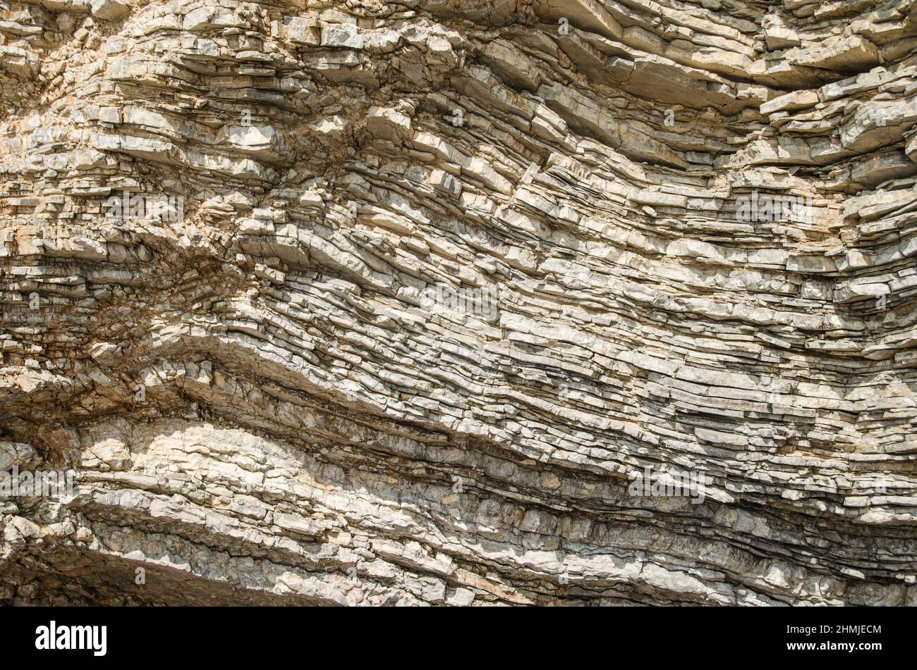 Rock, the background of the layers of ancient sediments.Layered stone ...