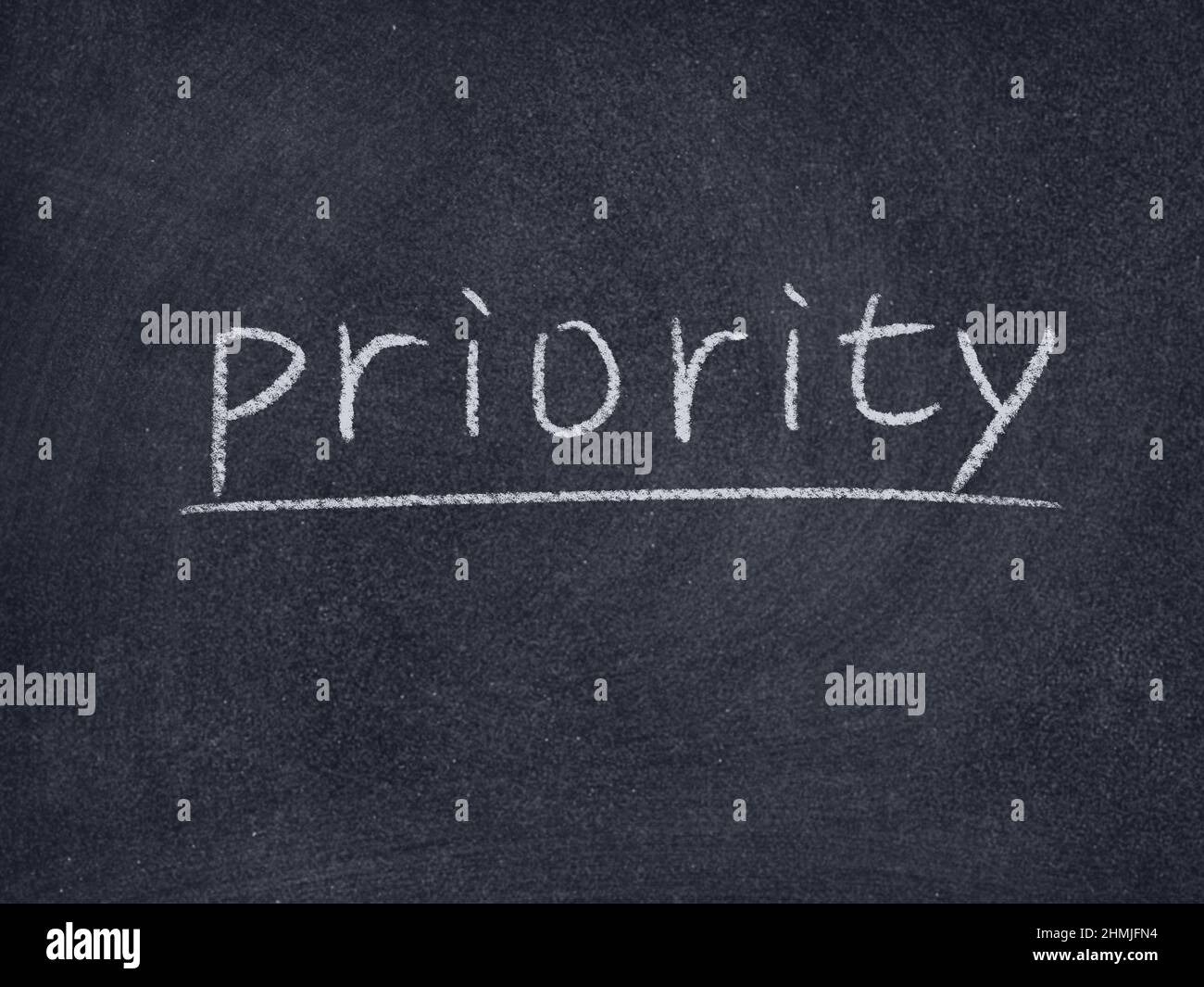 priority concept word on blackboard background Stock Photo - Alamy