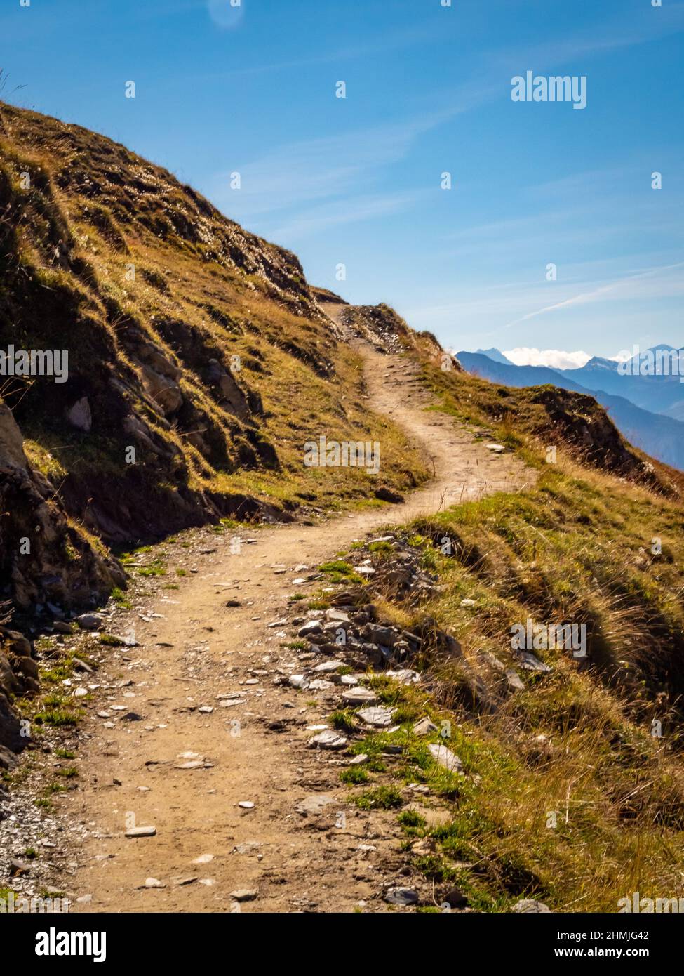 Mountain Hiking trail leading along a steep slope, upwards towards the ...