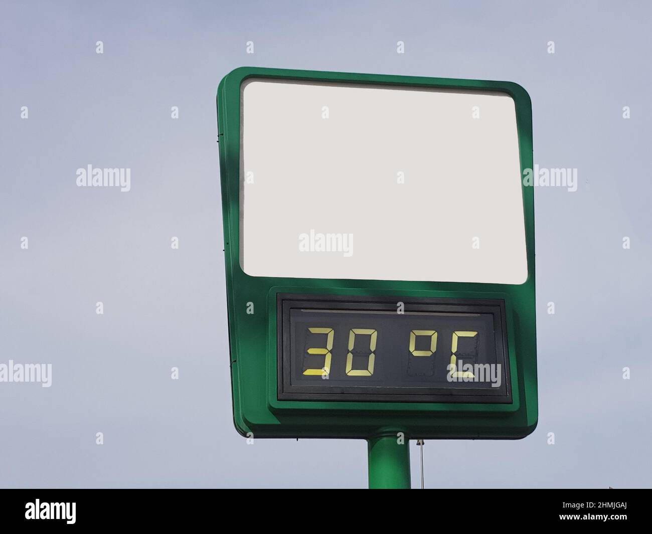 Electronic large thermometer on the building, indicating a high summer ...