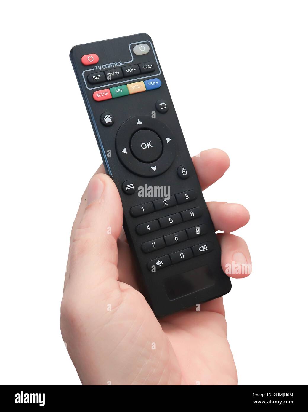 A man's hand with a close-up remote control. Black remote control with ...