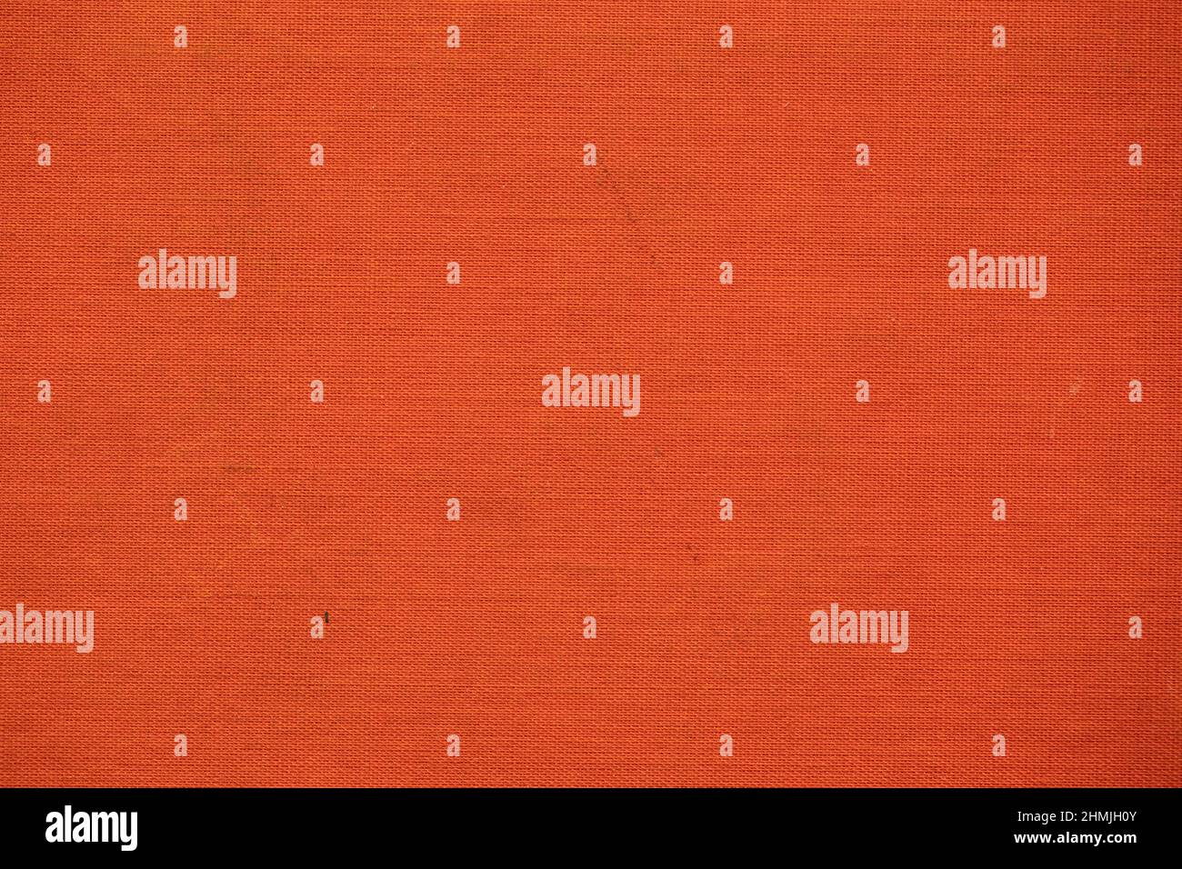 Old orange fabric with traces of burnout and abrasion. Binding of an ...