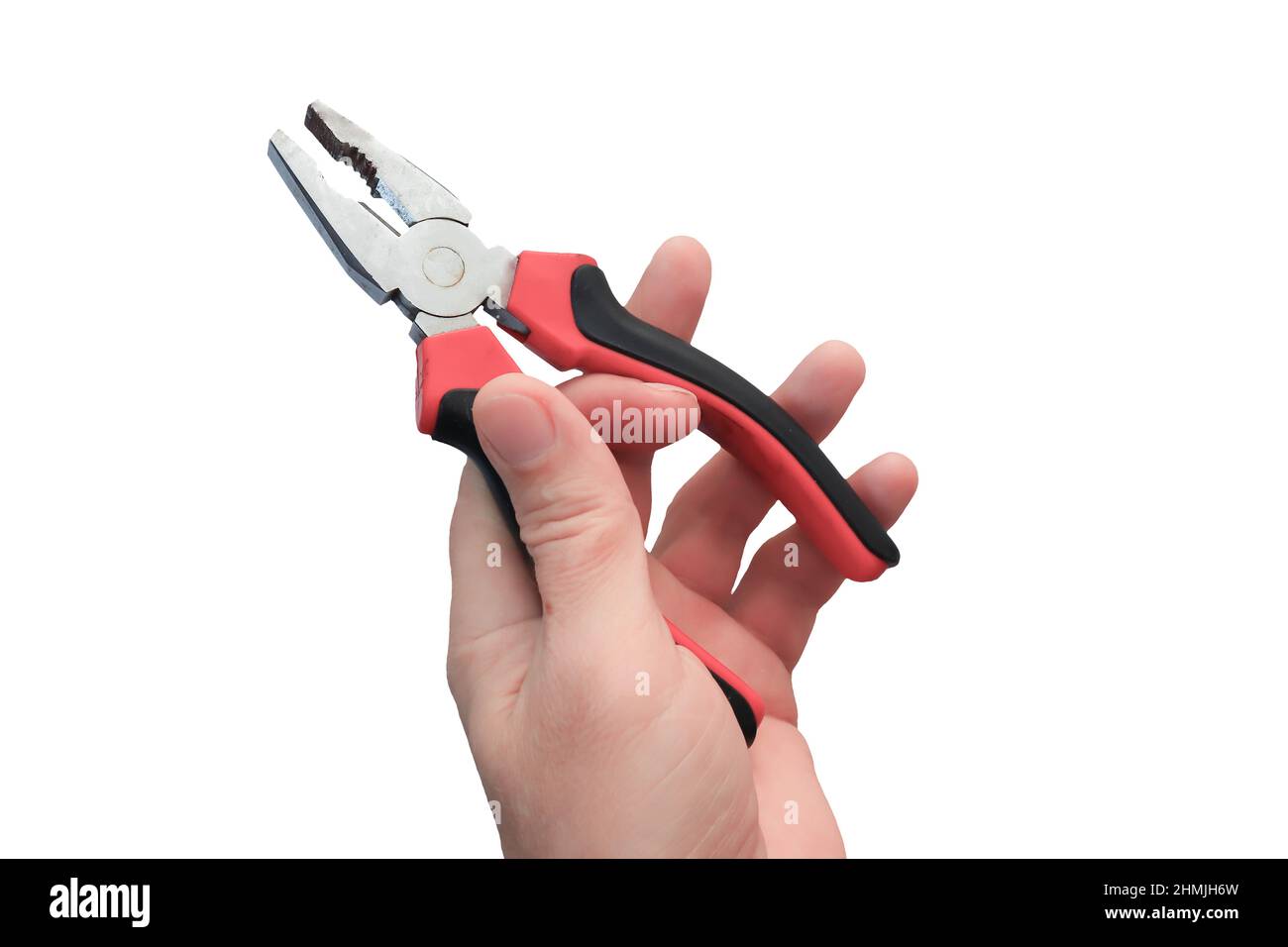 Master's hand with close-up pliers. Trade winds with insulated plastic ...