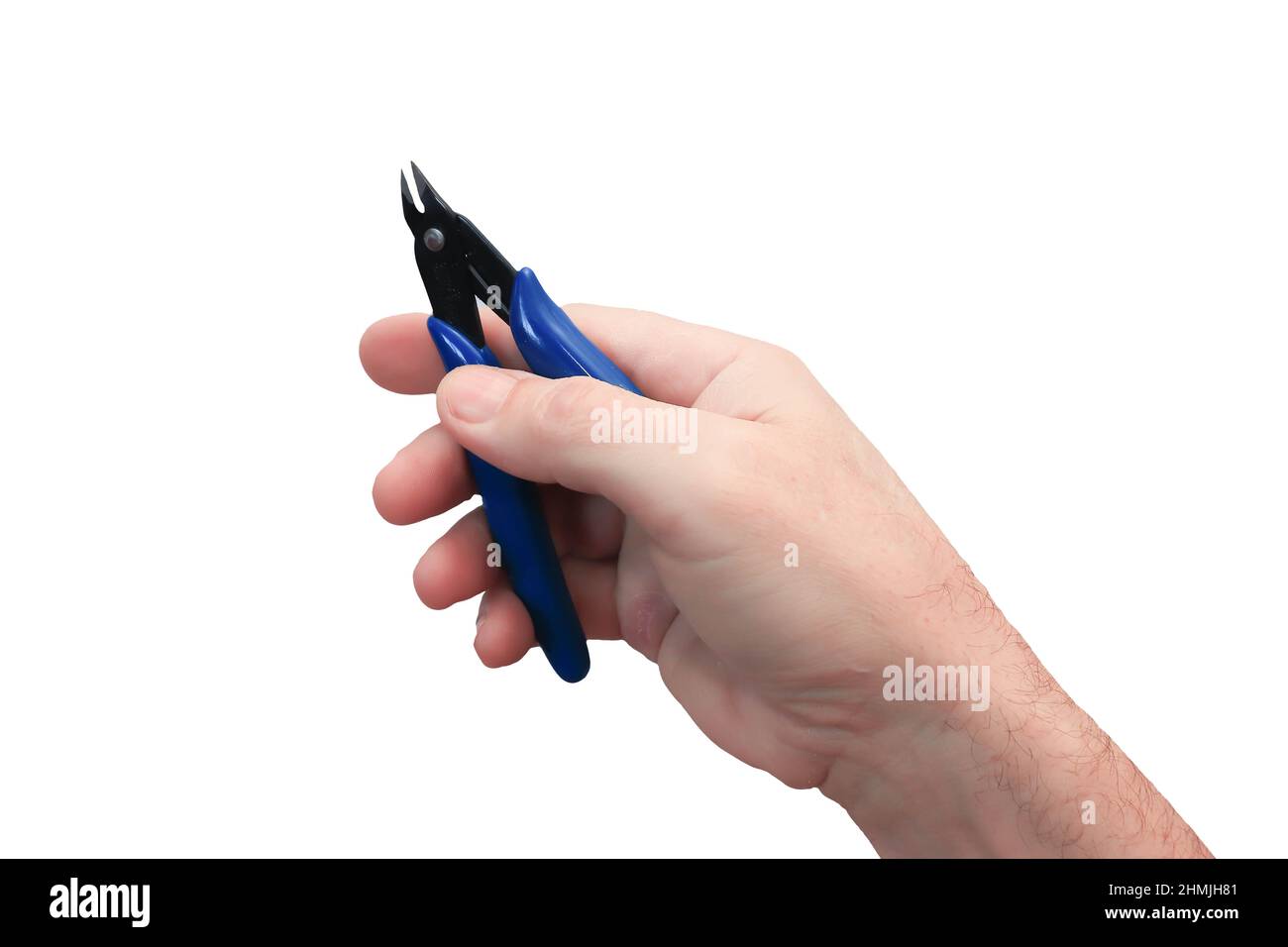 Master's hand with close-up side pliers. Wire cutters with blue plastic ...