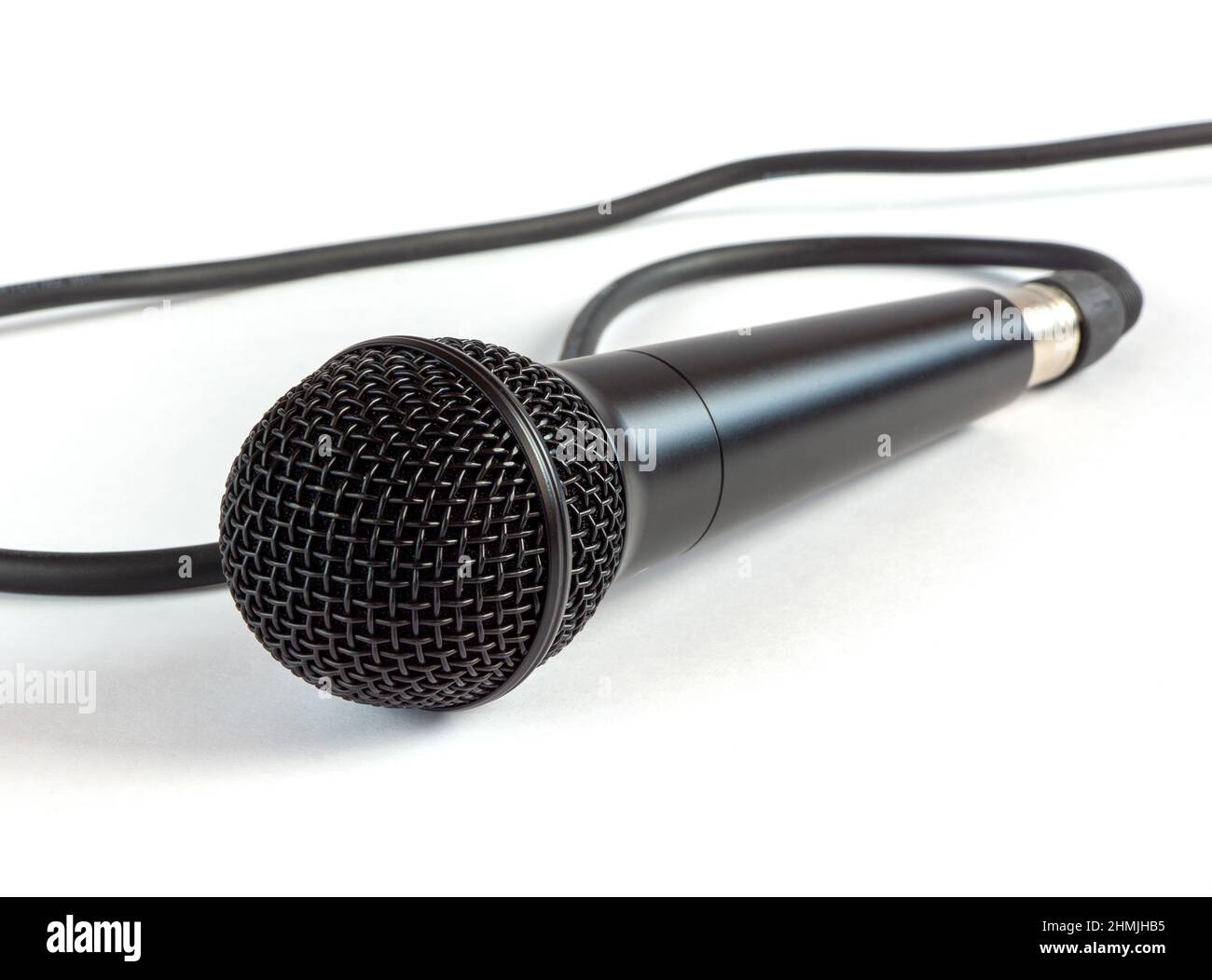 Microphone with a cable connected on white background Stock Photo - Alamy