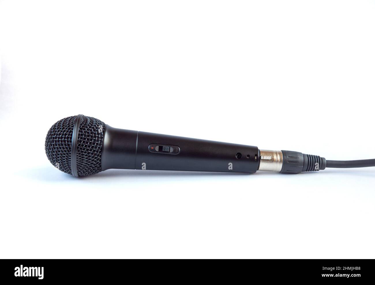 Microphone with a cable connected on white background Stock Photo - Alamy