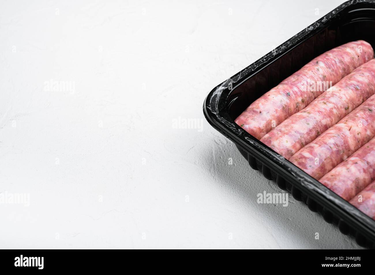 Flesh meat product for cooking packed in box set, on white stone table ...