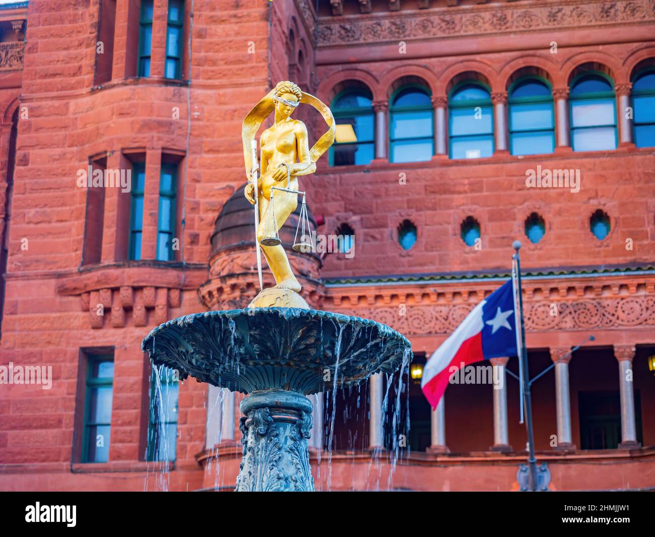 Sunny view of Courthouse building and Lady of Justice statue at Texas ...