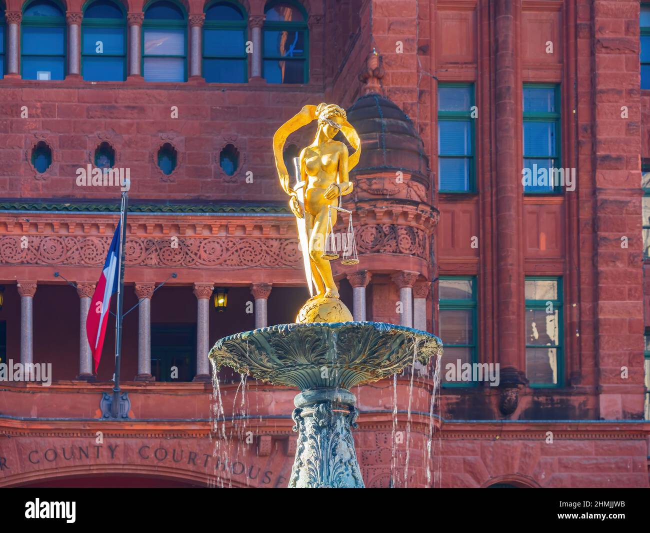 Sunny view of Courthouse building and Lady of Justice statue at Texas ...