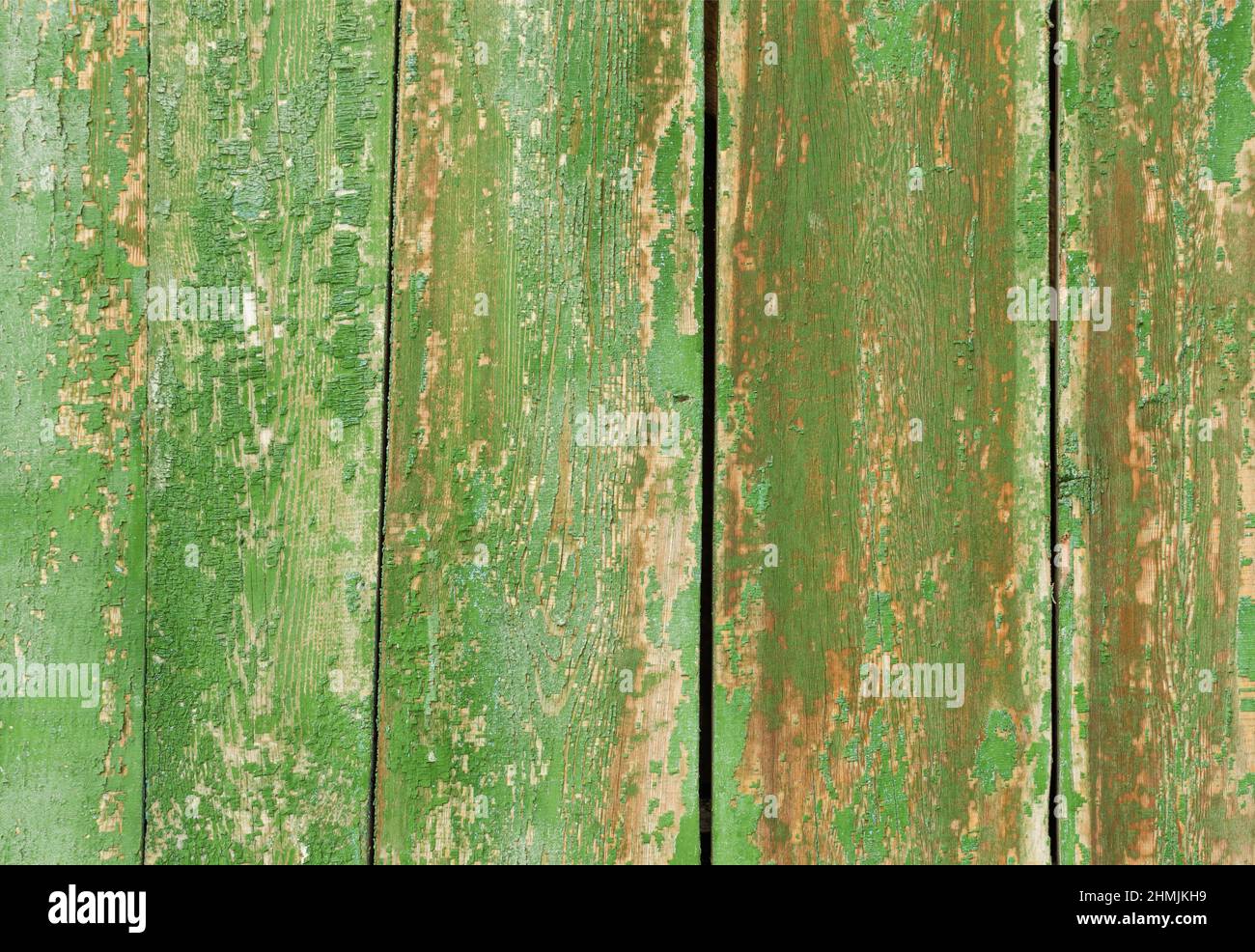 Background of old wooden boards, with a scalloped and wound green paint ...