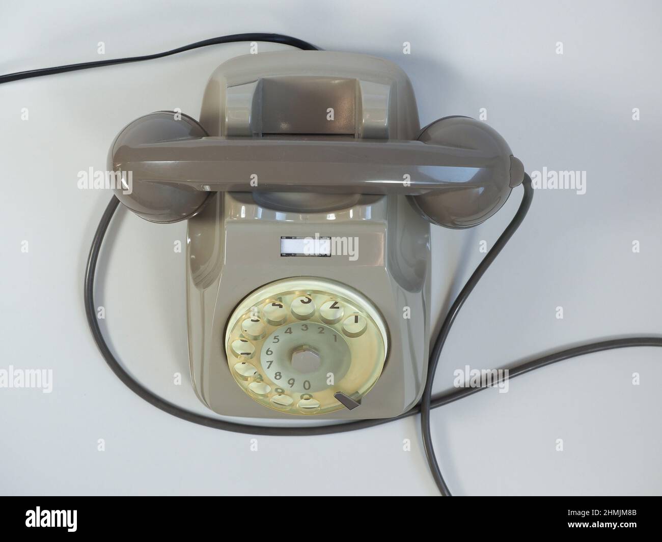 Vintage grey rotary dial analog landline telephone Stock Photo - Alamy