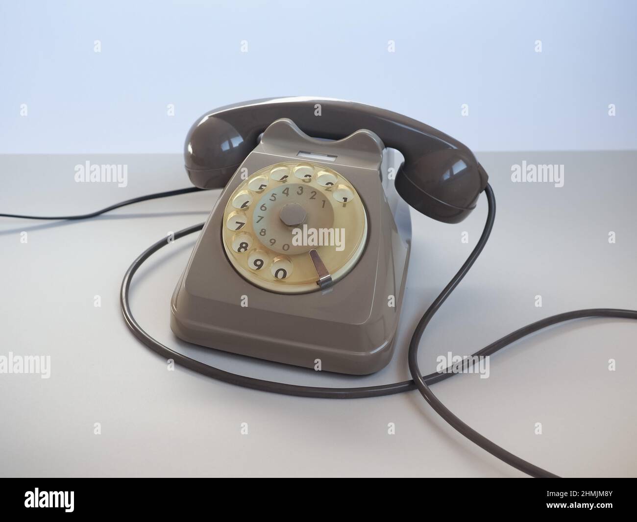 Vintage grey rotary dial analog landline telephone Stock Photo - Alamy