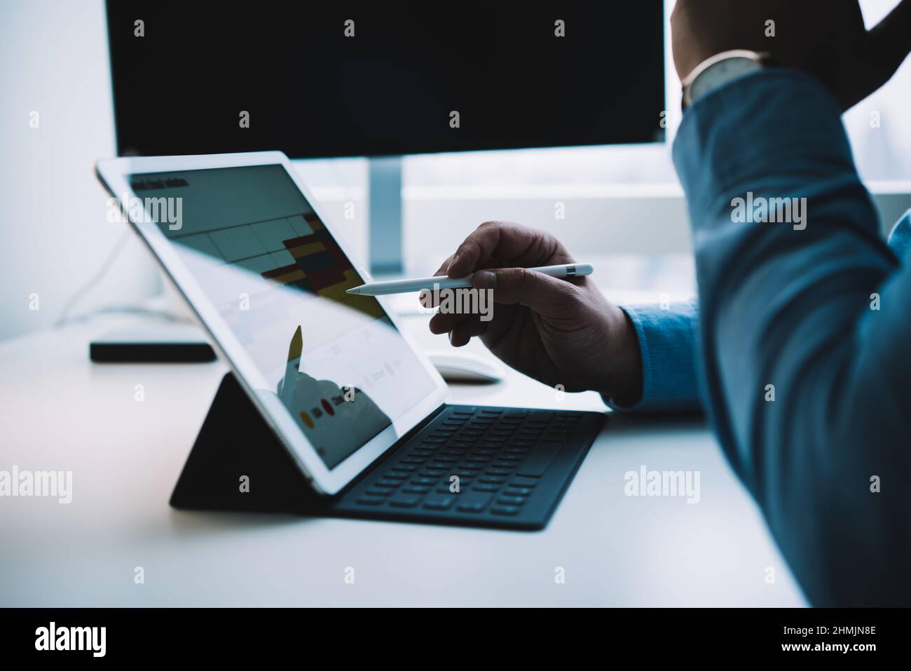 Faceless smart male entrepreneur working on tablet using stylus Stock ...