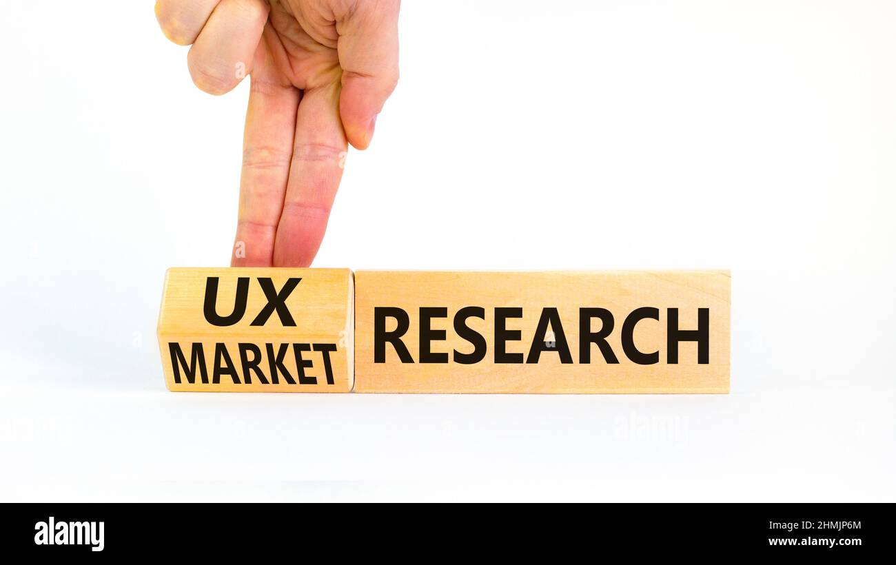 UX or market research symbol. Businessman turns wooden cubes and ...