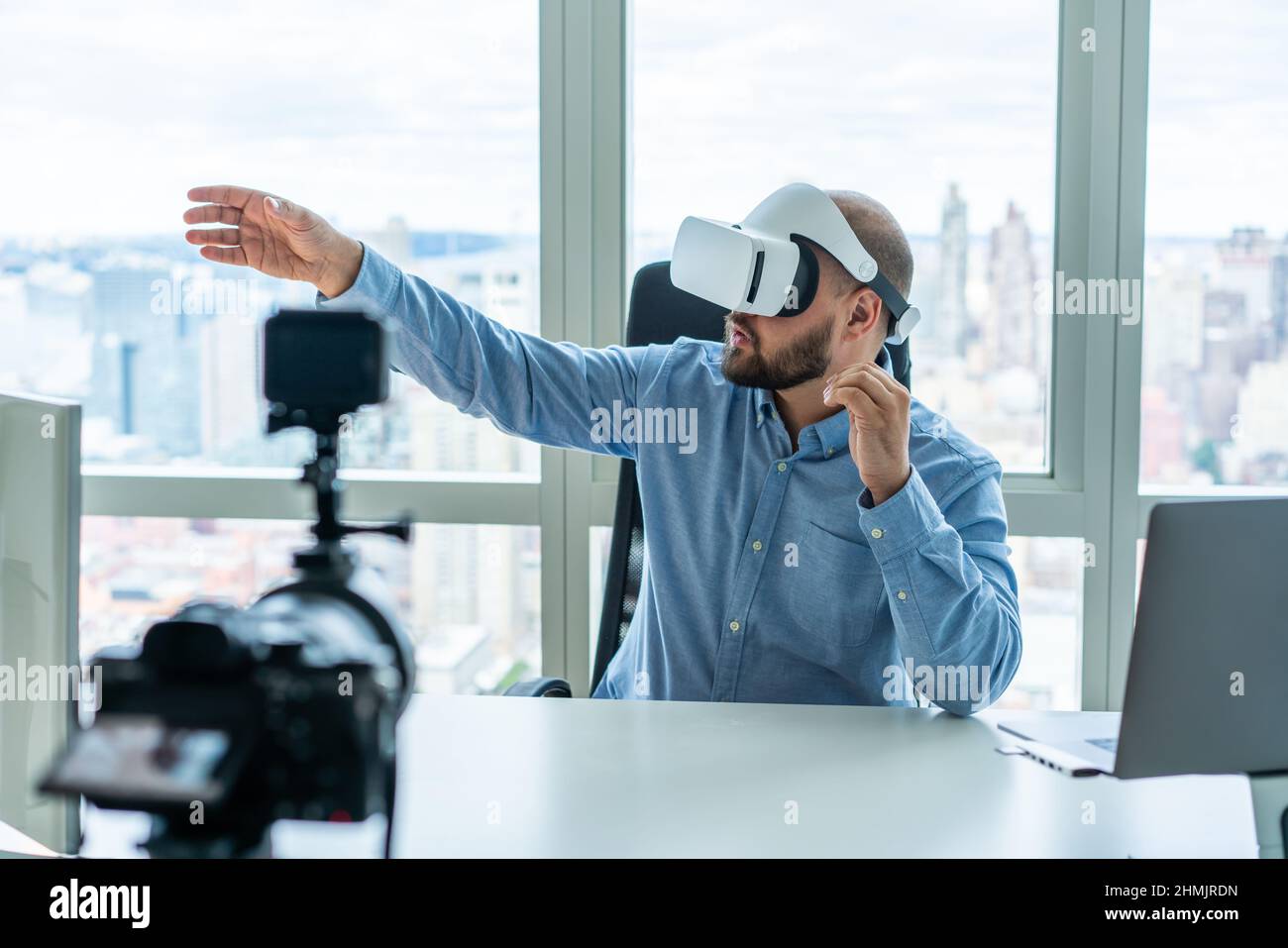 Serious businessman in VR glasses in office Stock Photo - Alamy