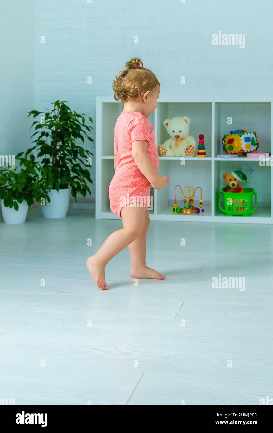 Baby feet learning to walk. Selective focus. Kid Stock Photo - Alamy