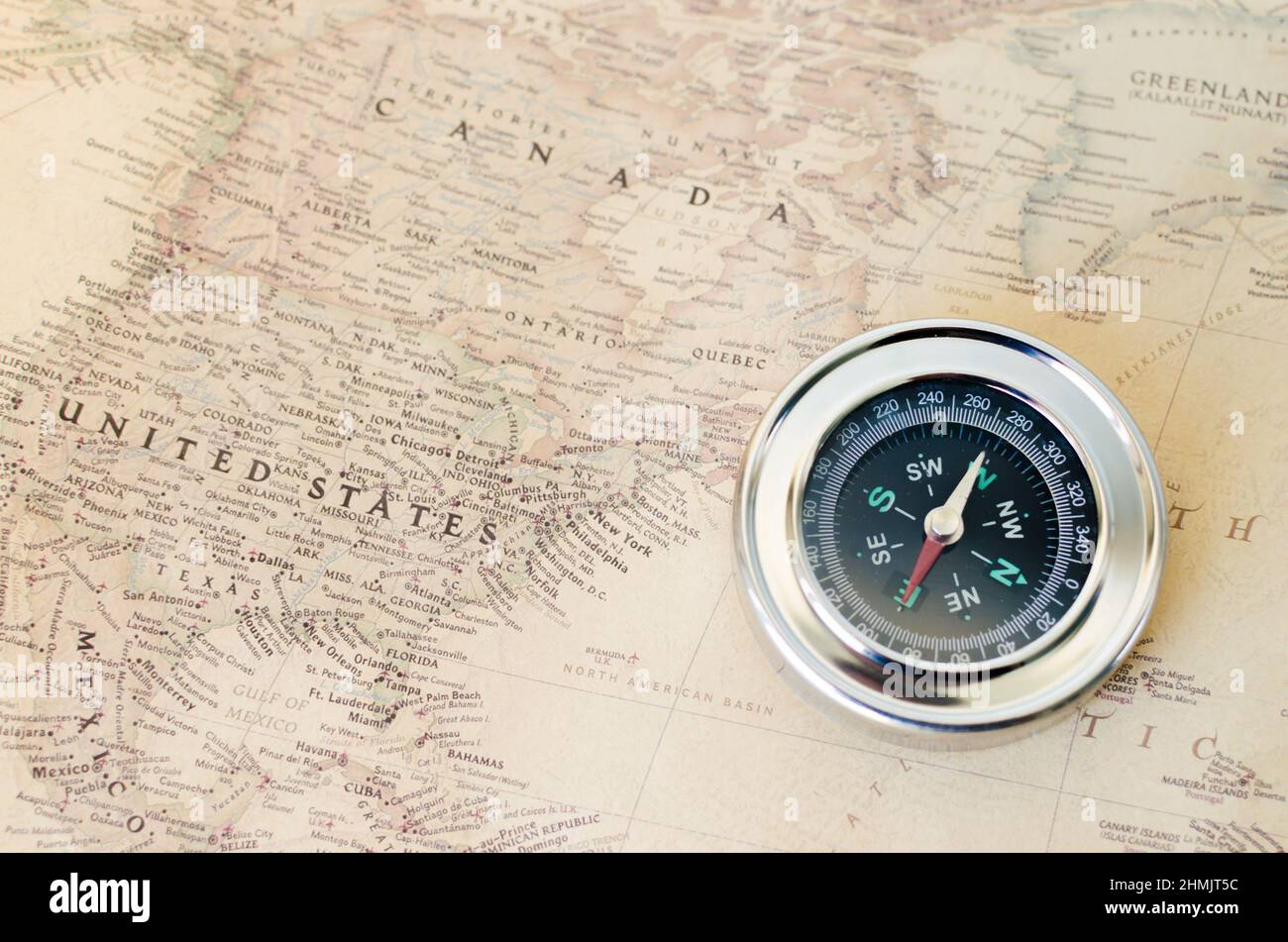 Compass on old map of America and Canada Stock Photo - Alamy