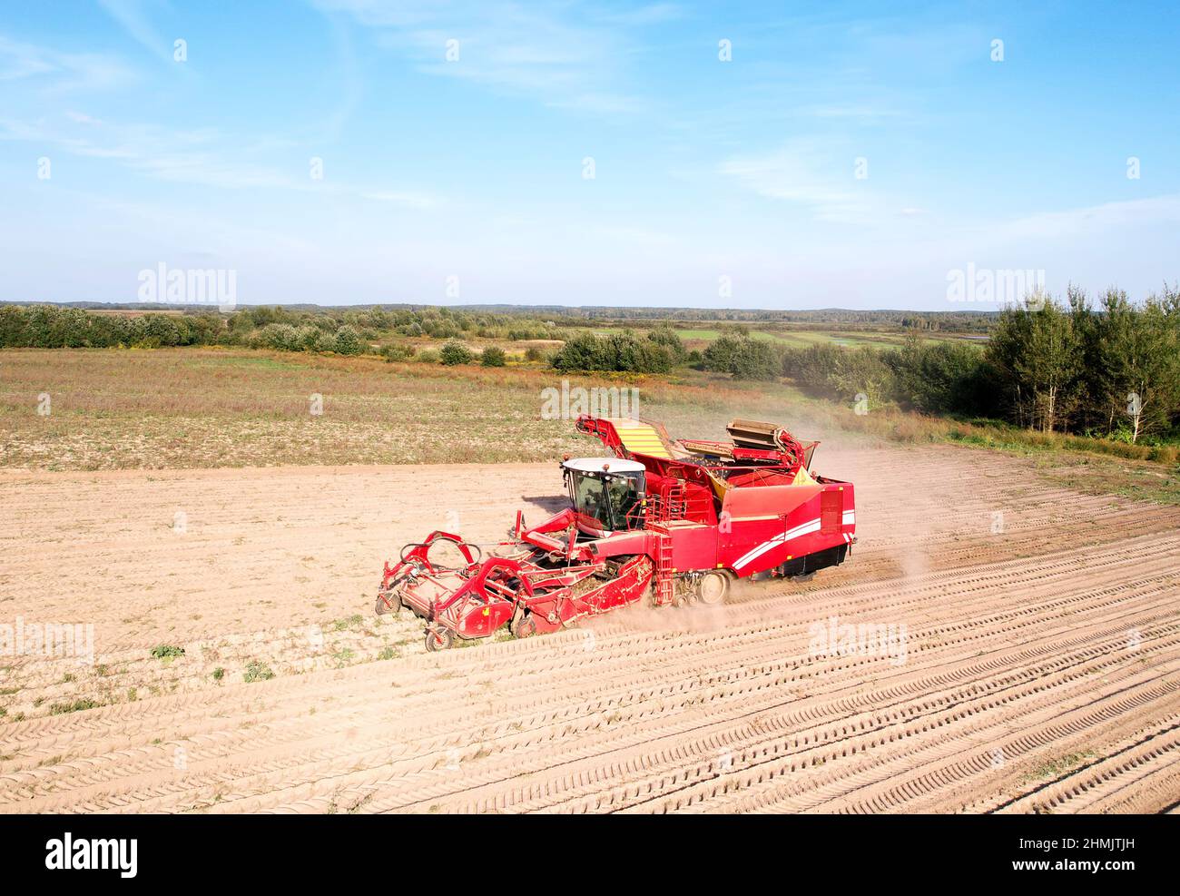 Potato Harvester at Seasonal harvesting of potatoes from field ...