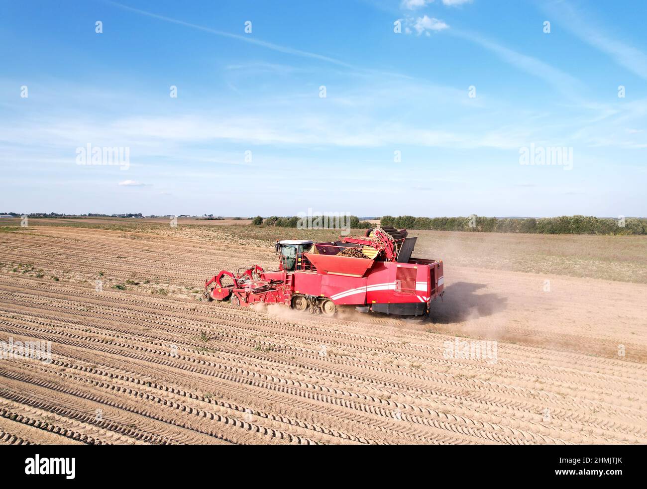 Potato Harvester at Seasonal harvesting of potatoes from field ...